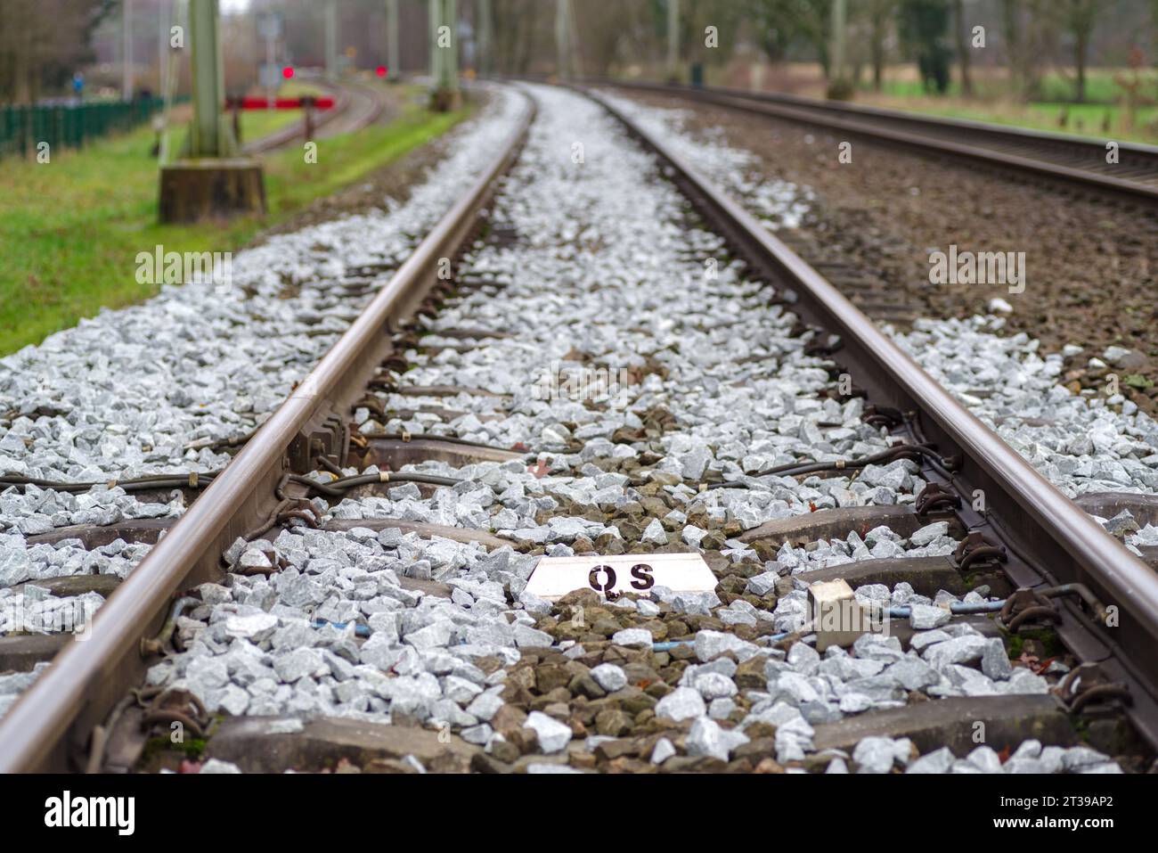 obstacle sign in the middle of a railroad track Stock Photo - Alamy
