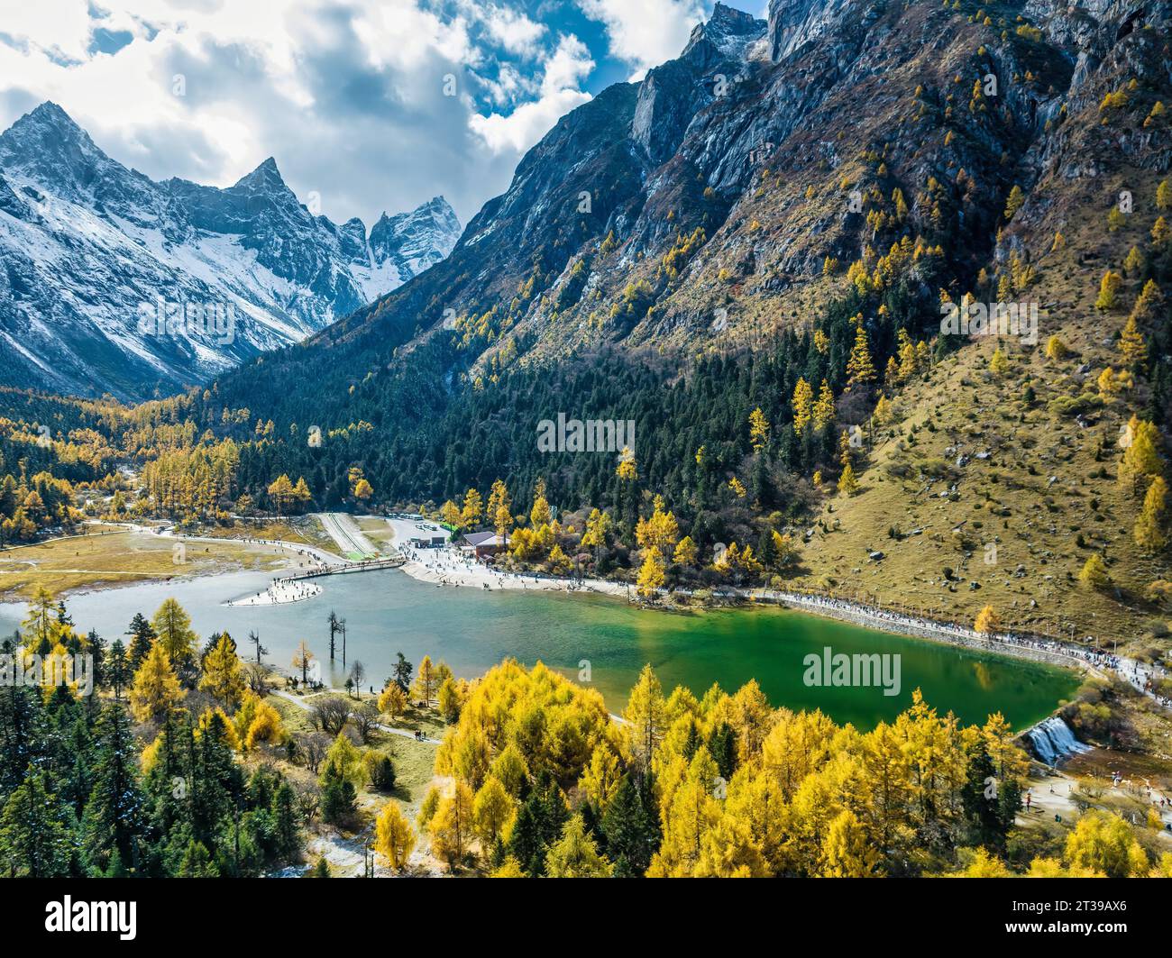 Aerial photo shows the autumn snowy scenery of Bipenggou Valley scenic ...