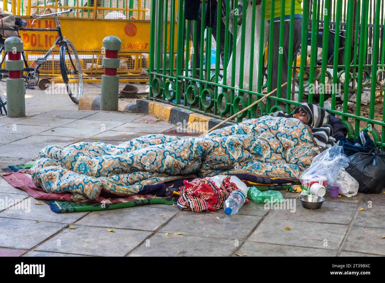 Homeless man sleeping on the street Stock Photo - Alamy
