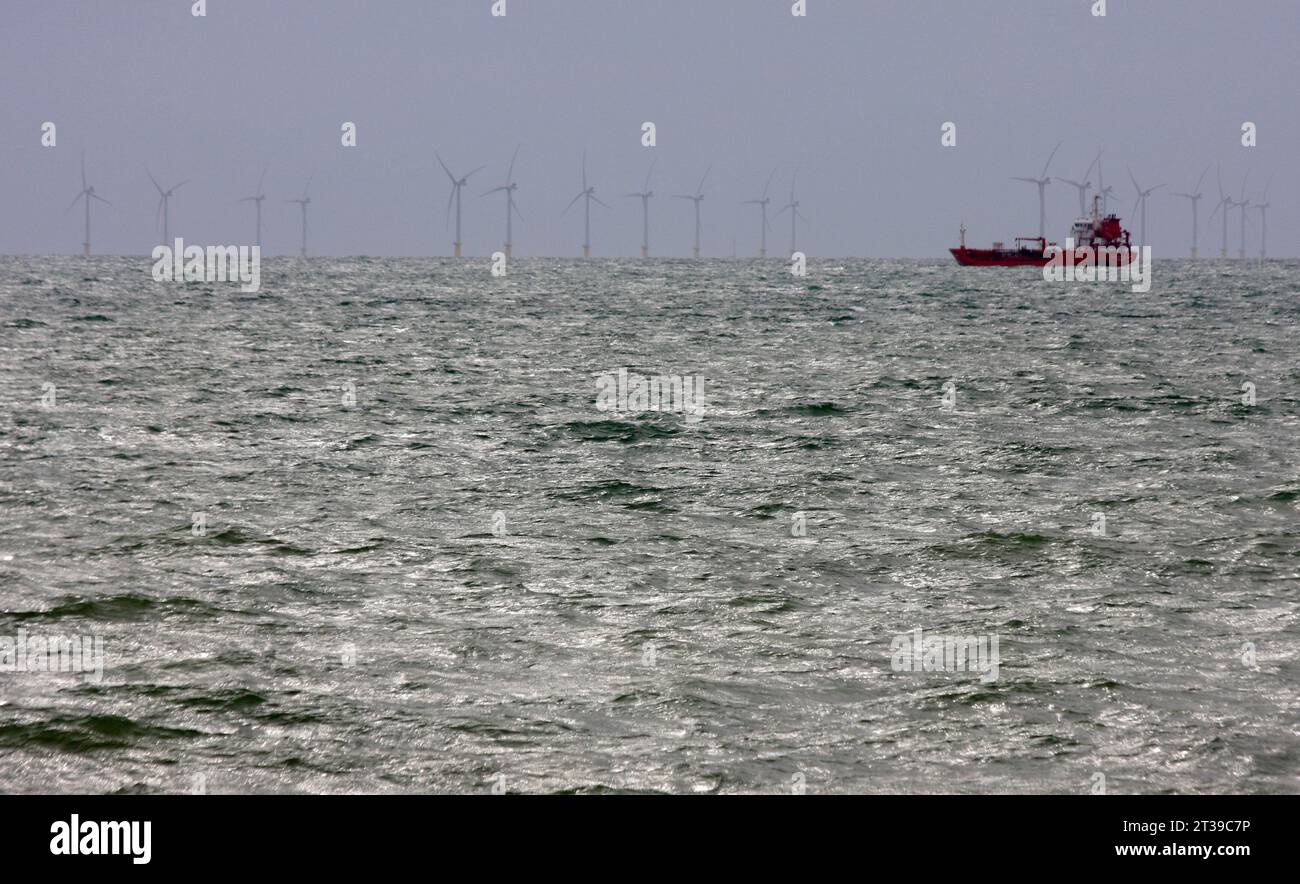 A ship passes in front of the offshore Rampion wind farm at Shoreham ...