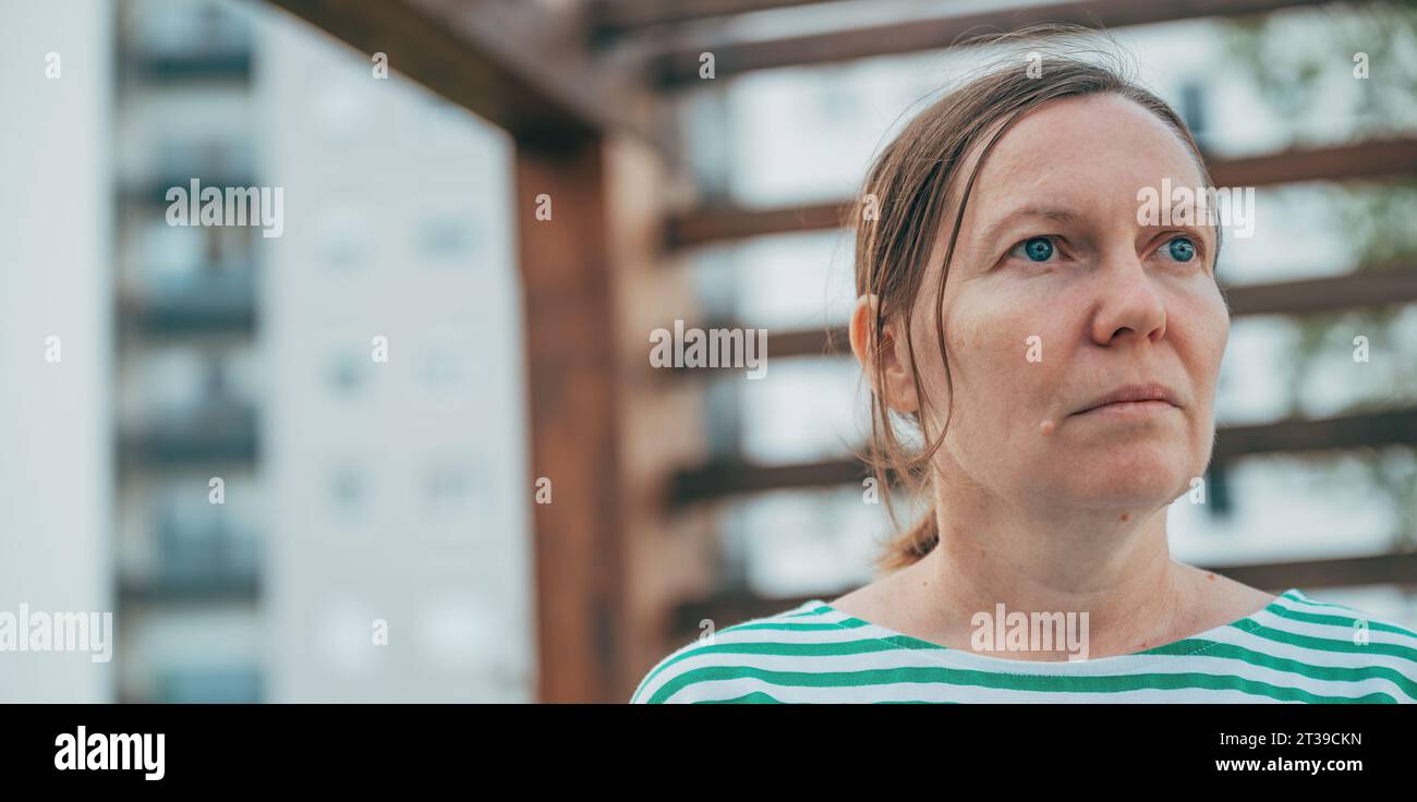 Headshot portrait of serious female person with small ponytail ...
