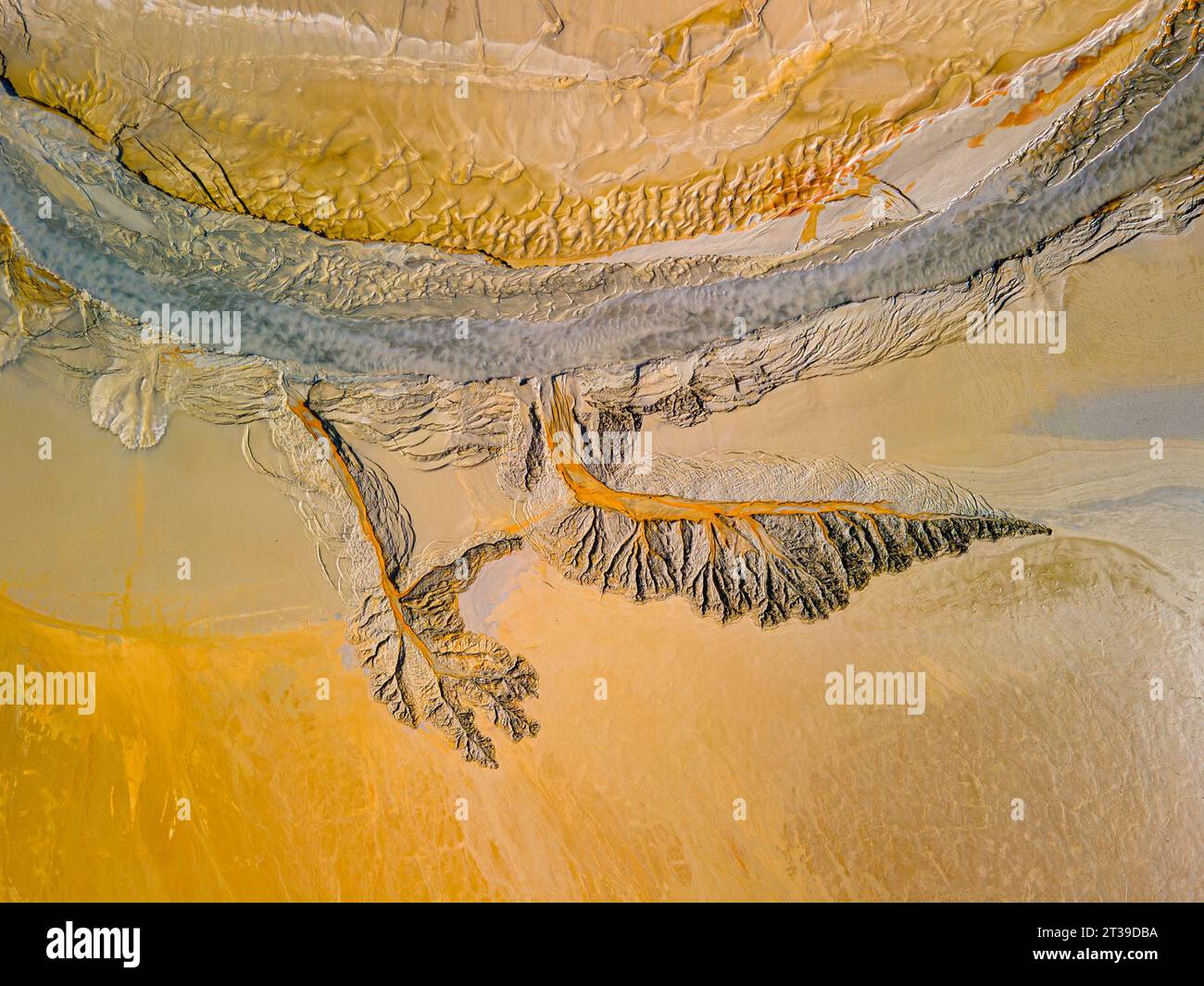 Aerial depiction of contrasting desert landforms with winding water ...