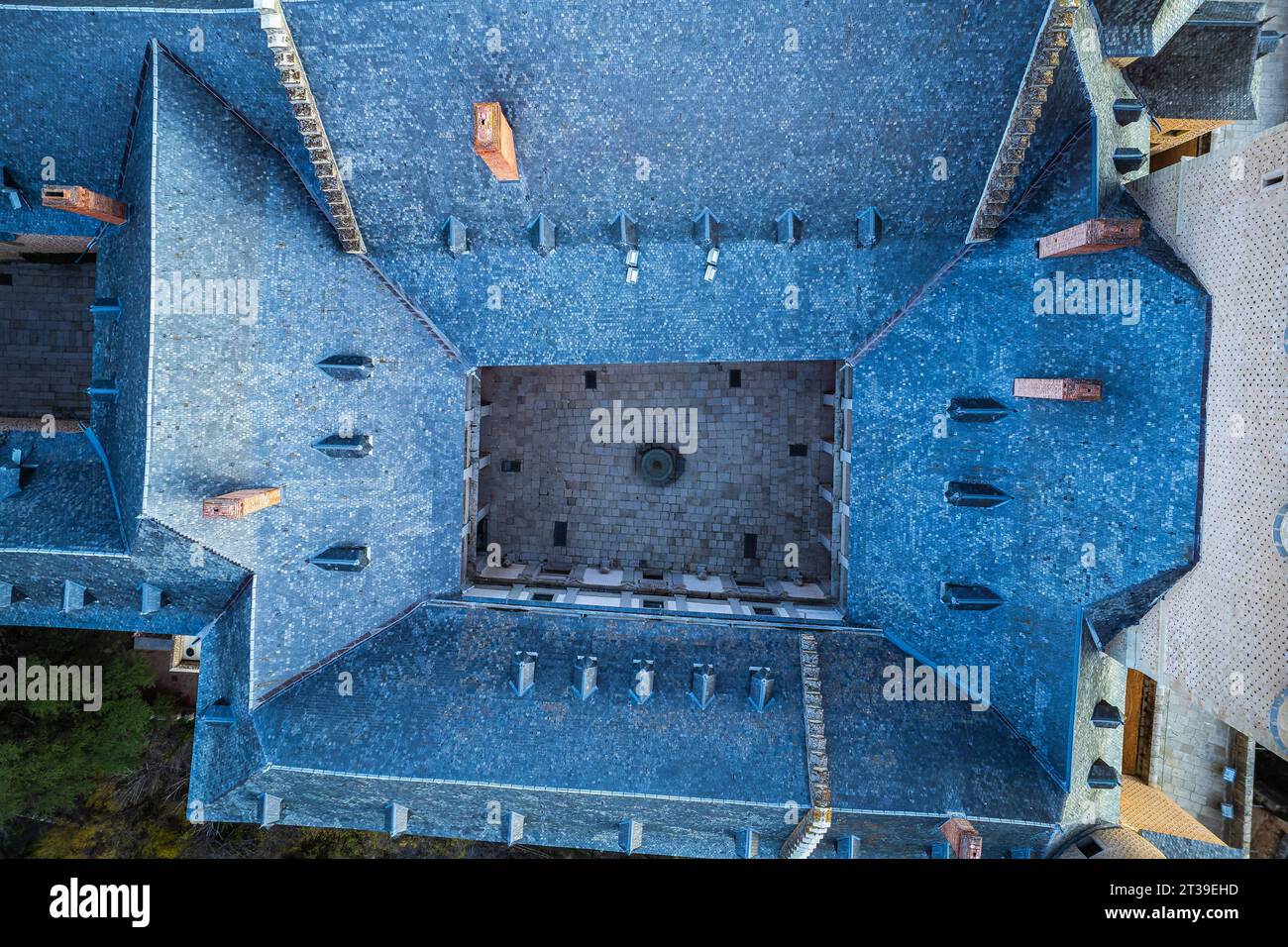 Aerial top view of medieval castle Alcazar of Segovia Spain with blue ...