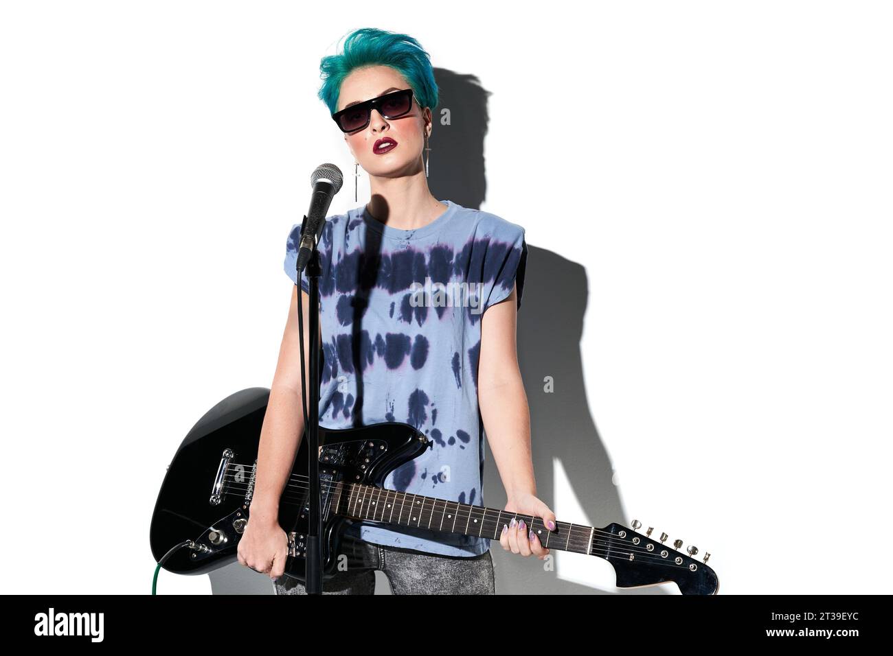 Young female rock star mic hi-res stock photography and images - Alamy