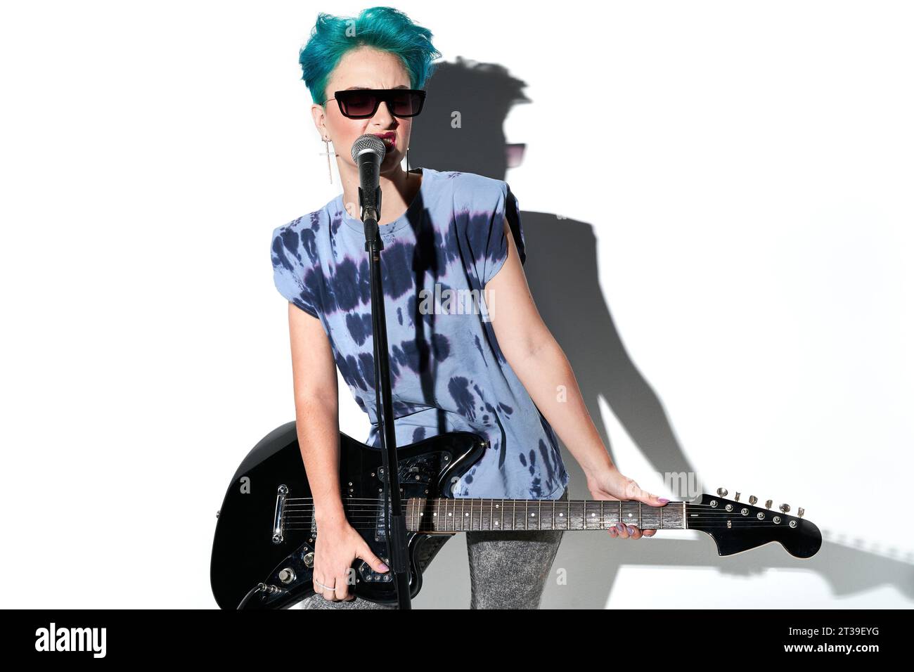 Young female rock star mic hi-res stock photography and images - Alamy