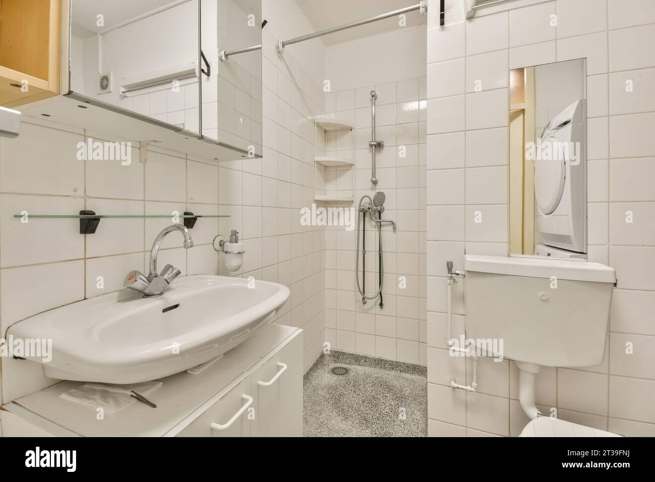 Ceramic sink with flush toilet and shower booth in modern bathroom with ...