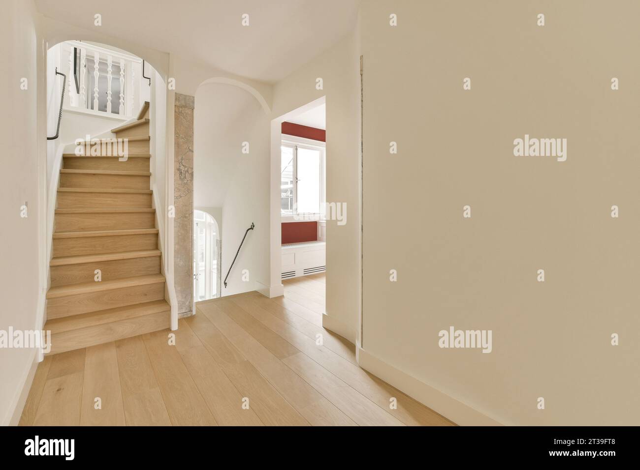 Wooden steps leading to upper floor in renovated house and empty ...