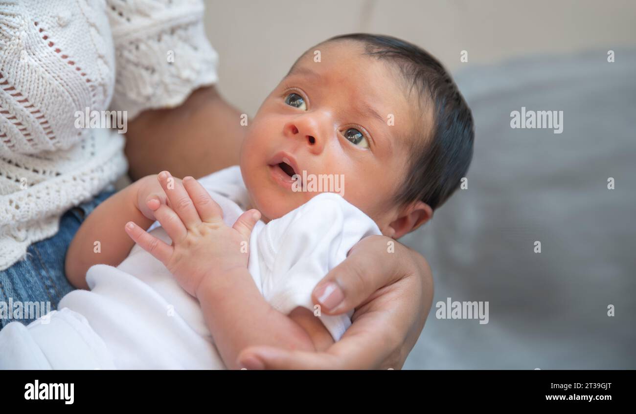 Baby from above arms hi-res stock photography and images - Alamy