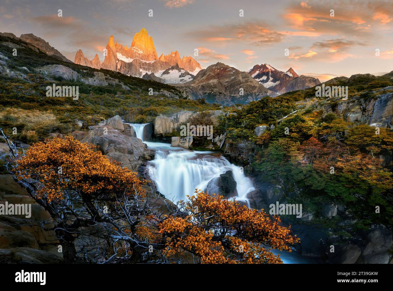 Photo of a majestic waterfall surrounded by the stunning landscape of ...