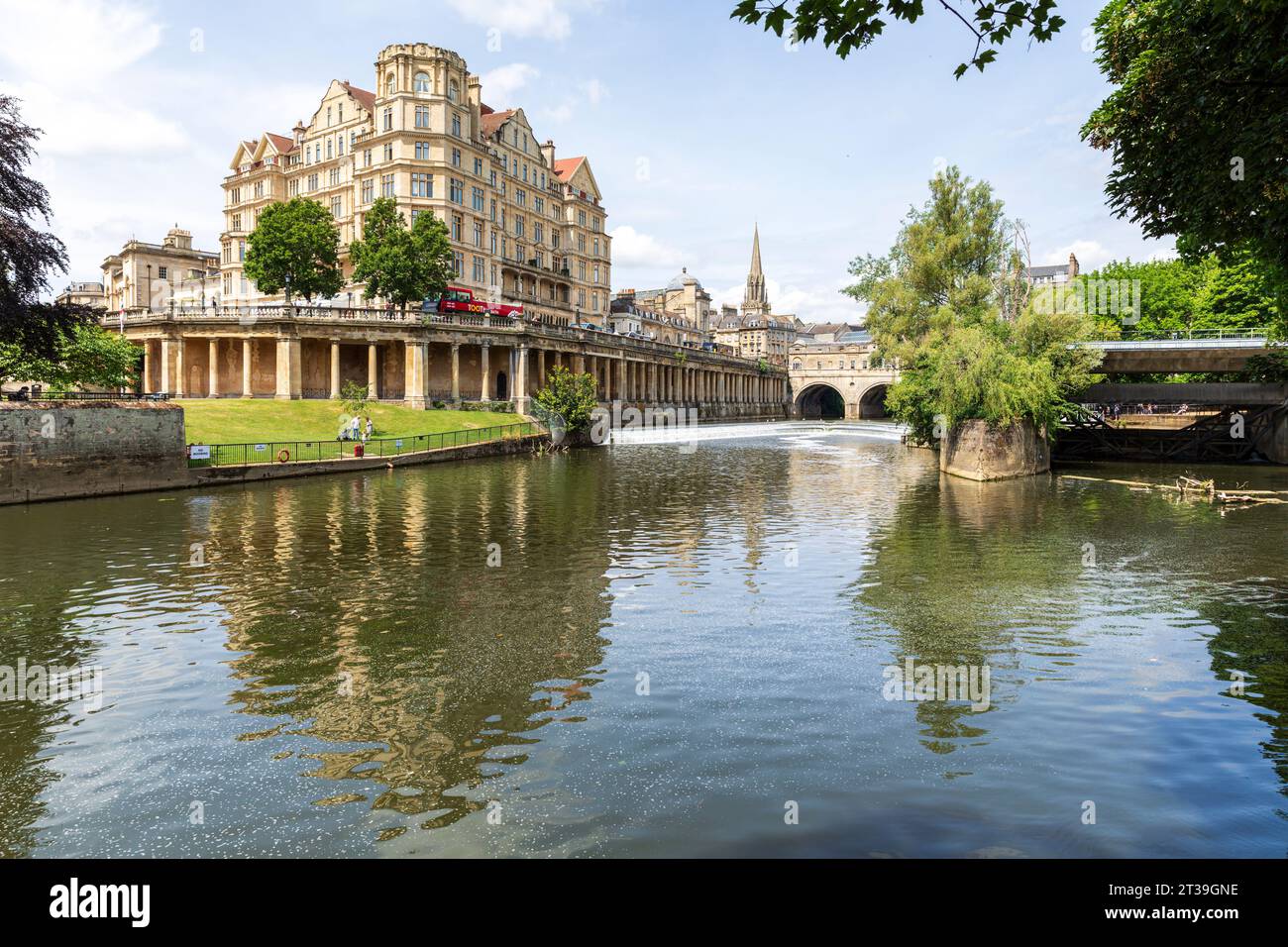 Pulteney Bridge & Weir, with the spire of St Michael's Church in the ...