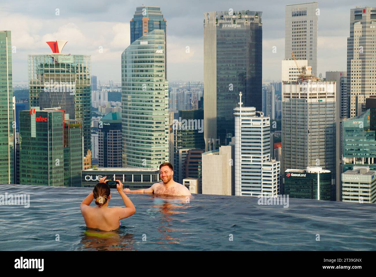 Non Exclusive: Couple takes a picture at the Marina Bay Sands Infinity Pool. Singapore ...