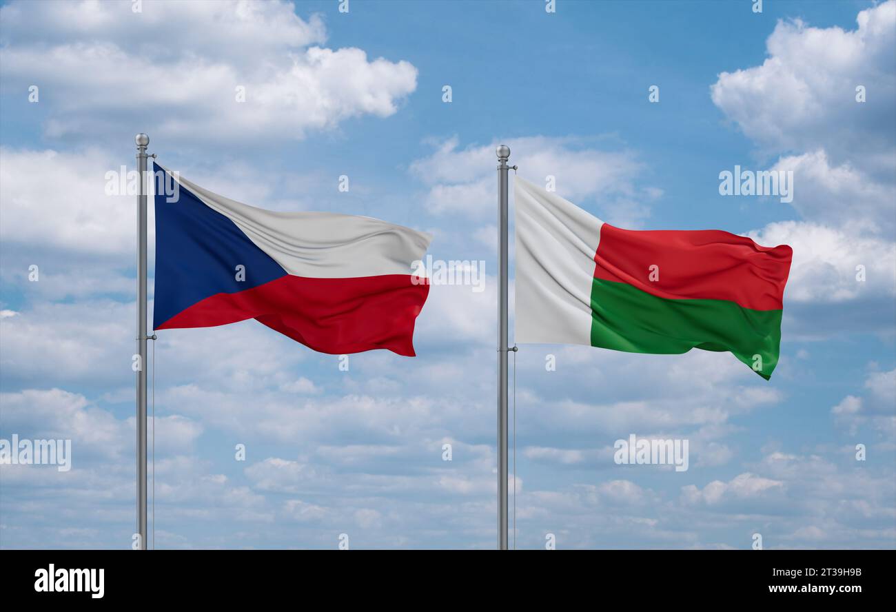 Madagascar and Czech flags waving together on blue cloudy sky, two ...