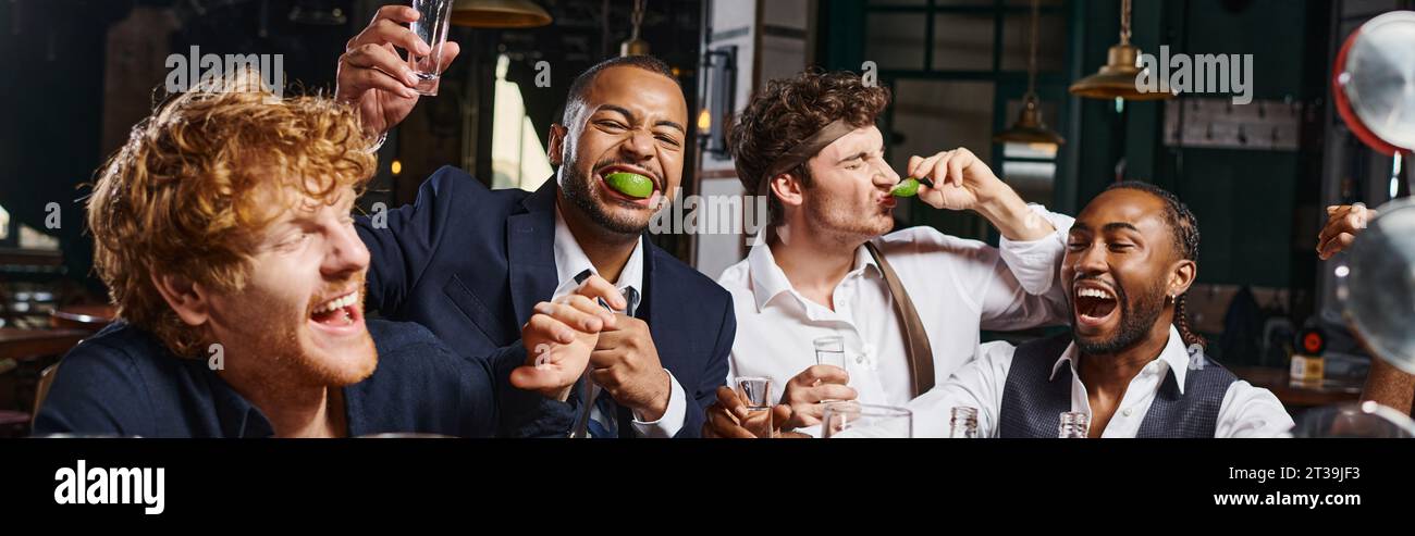 banner of four happy and drunk multiethnic friends in formal wear ...