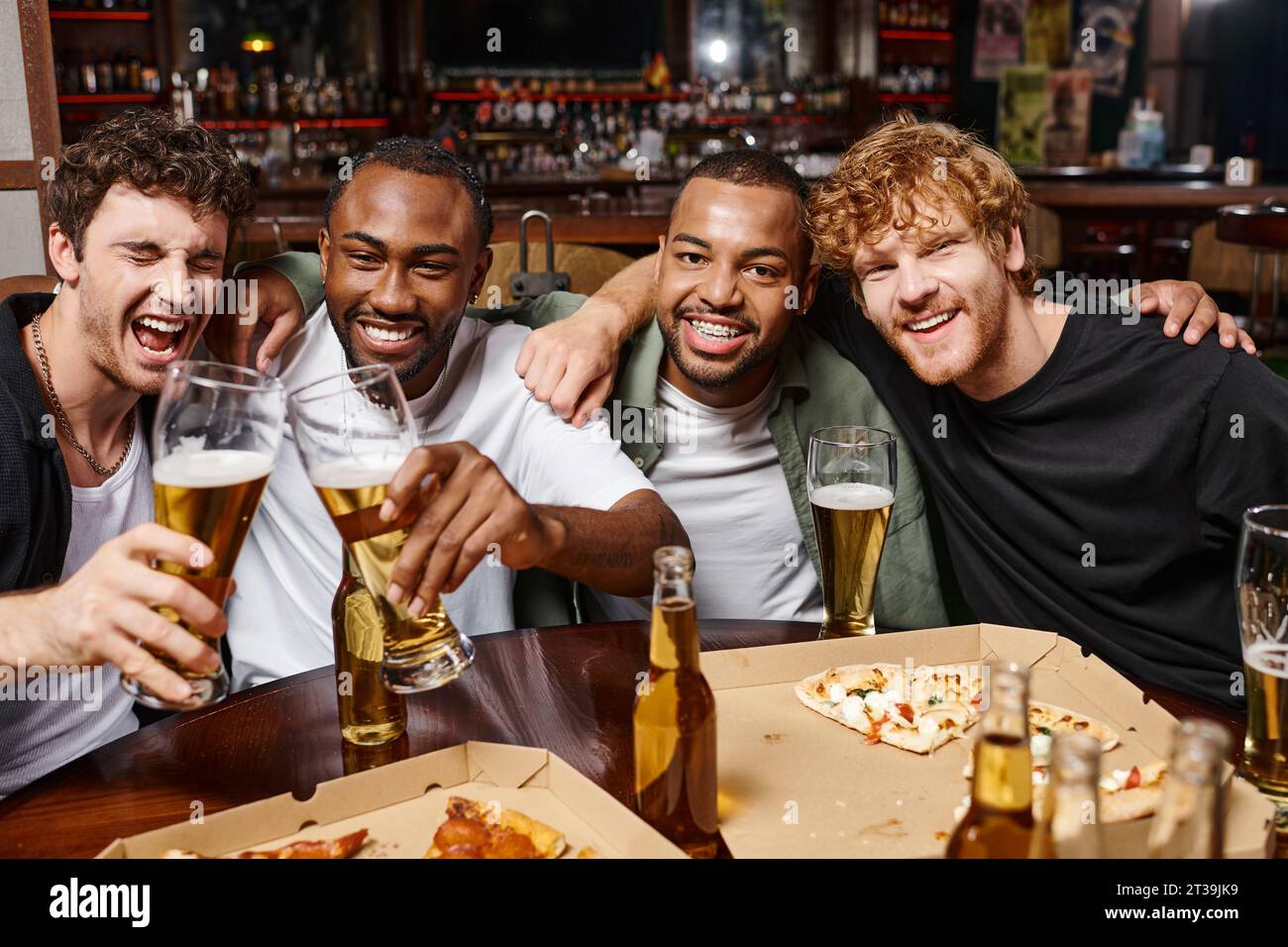 Group Of Happy Multiethnic Friends Hugging And Toasting With Glasses Of