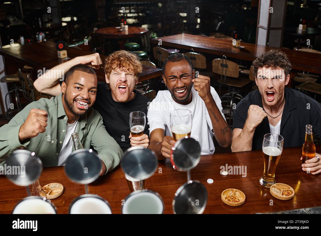 Four diverse football fans hi-res stock photography and images - Alamy