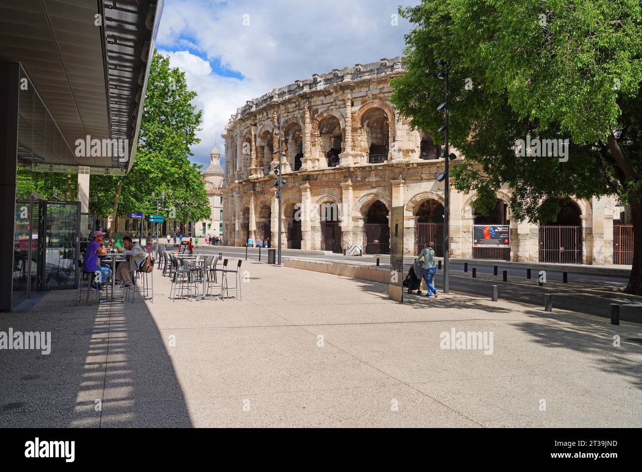 NIMES, FRANCE – 14 MAY 2023- Sunny view of the Roman Arena in Nimes ...