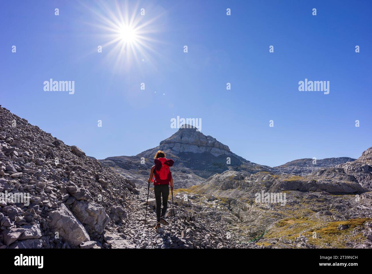 hiker walking under a hot sun, Anie peak, Larra limestone plateau ...