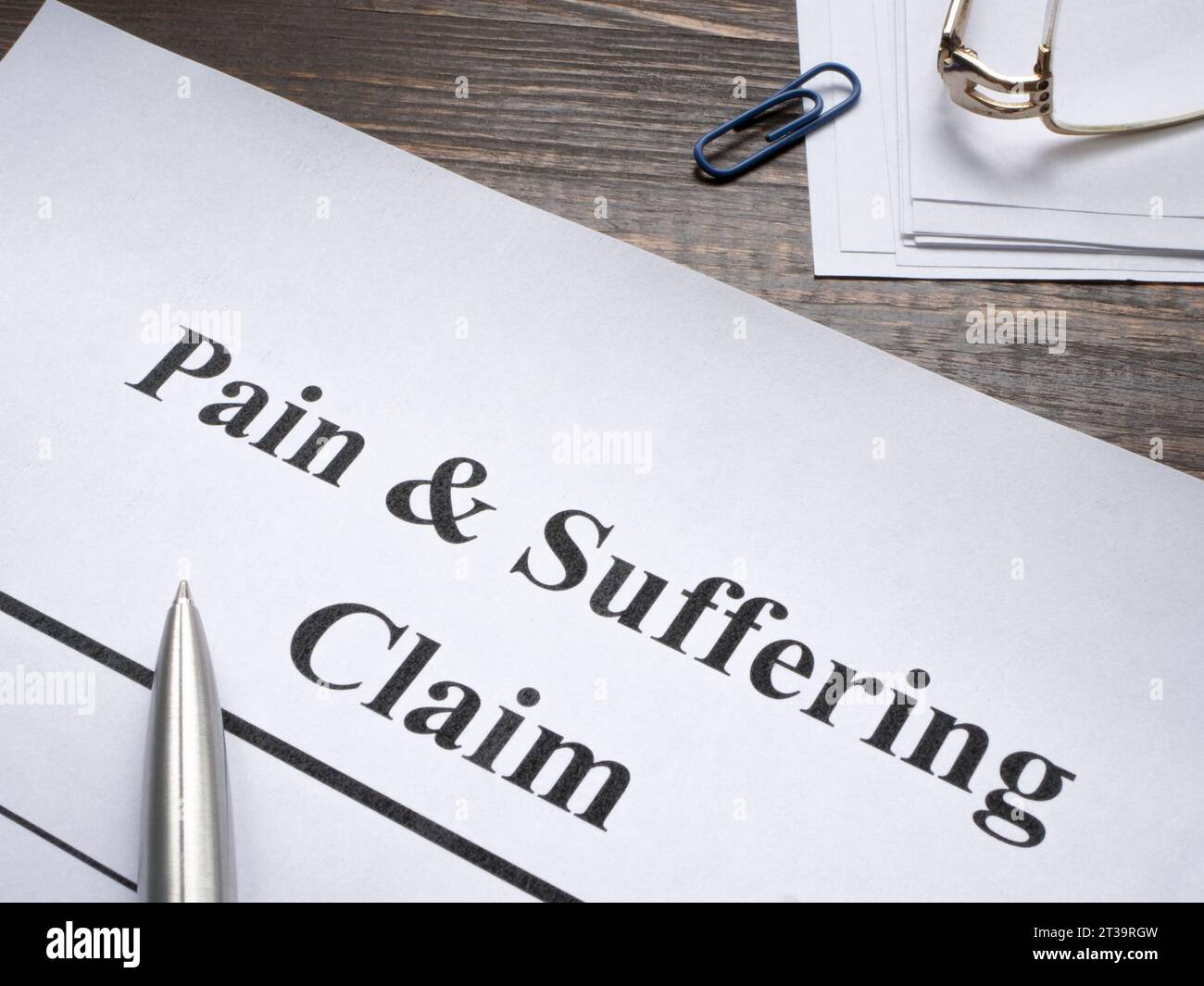 Pain and suffering claim with a pen for signing Stock Photo - Alamy