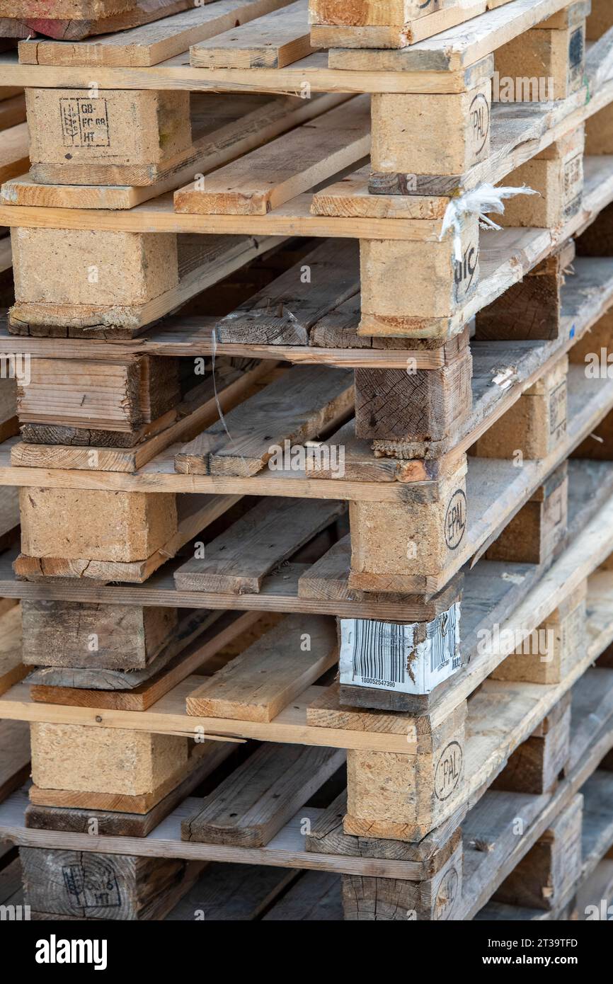 abstract of wooden fork lift pallets stacked in a pile ready for ...
