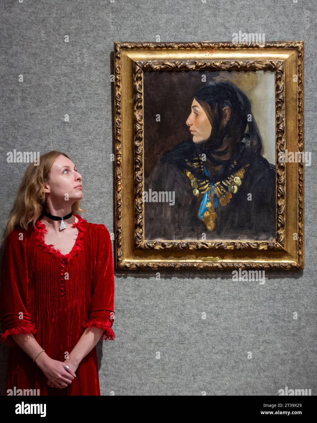 London UK 24 October 2023 A Staff Member Views Egyptian Woman Coin