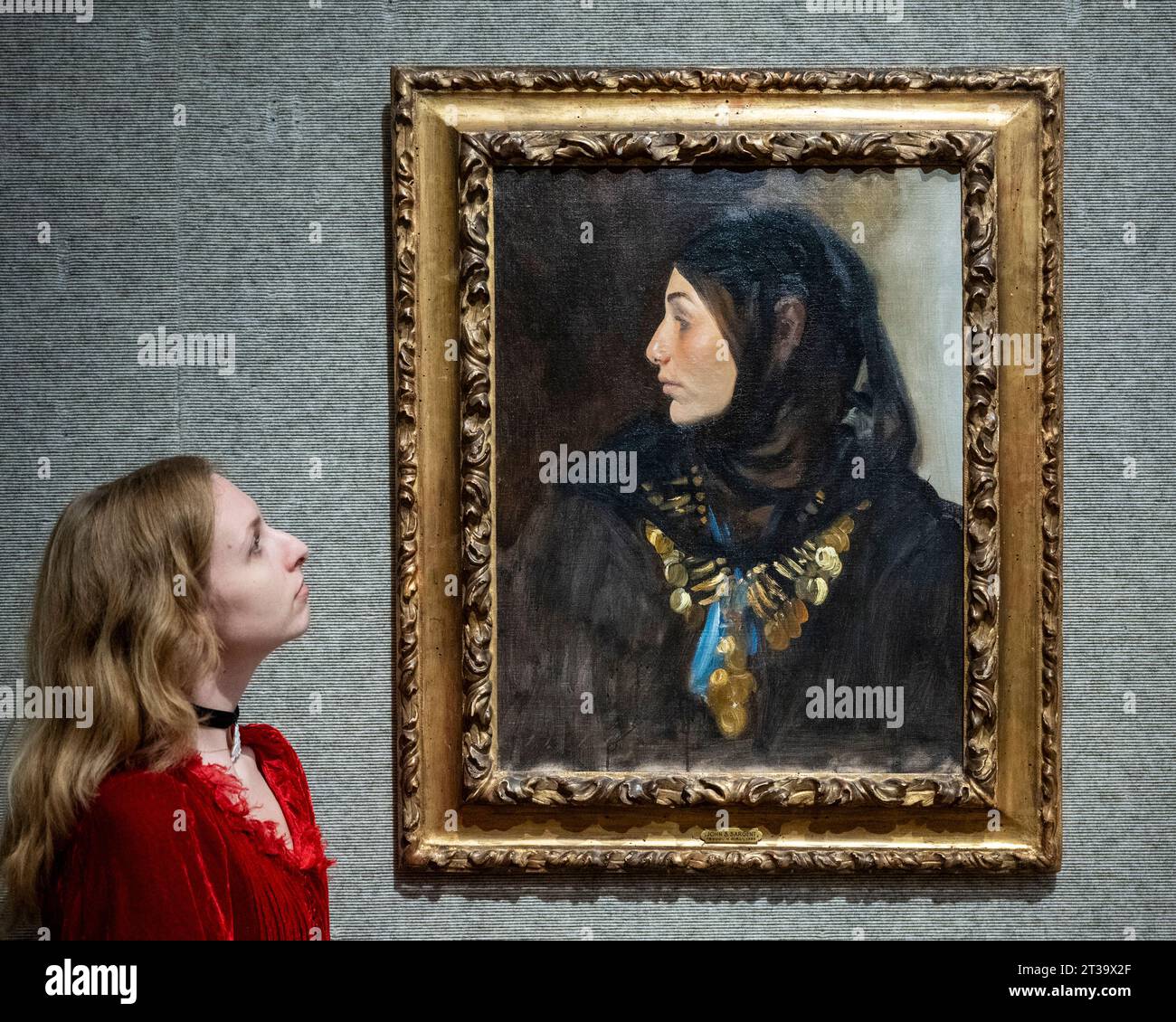London UK 24 October 2023 A Staff Member Views Egyptian Woman Coin