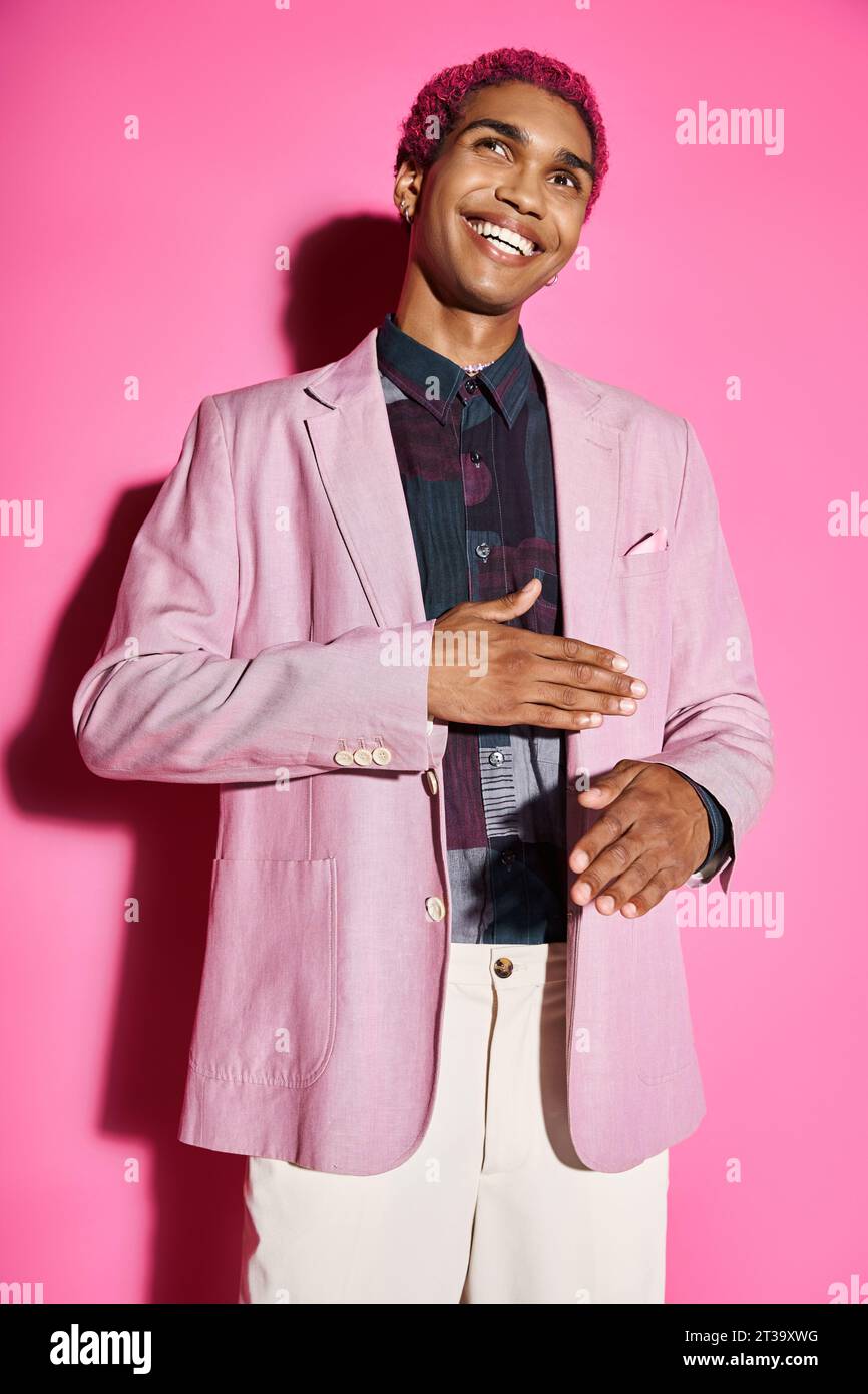 handsome young man acting unnaturally like doll smiling and posing on ...