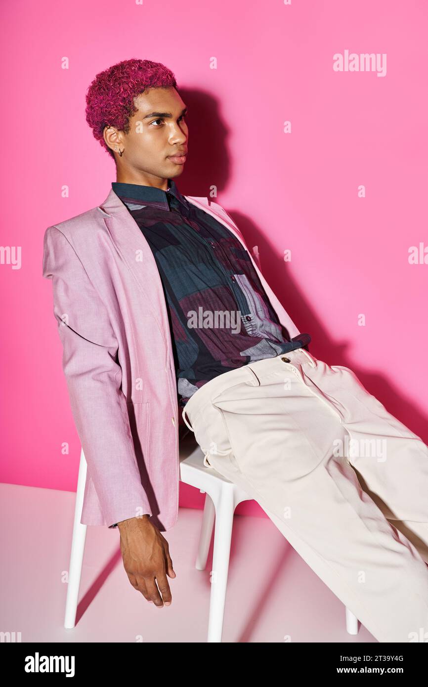 handsome african american man acting like male doll in pink blazer and ...