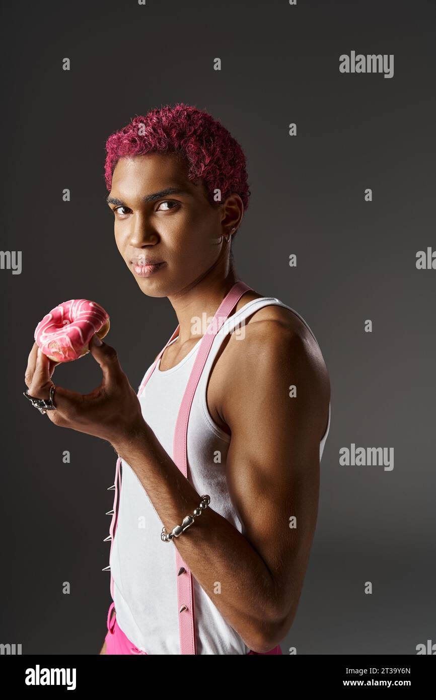 jolly pink haired man in stylish attire with pink hair posing with ...