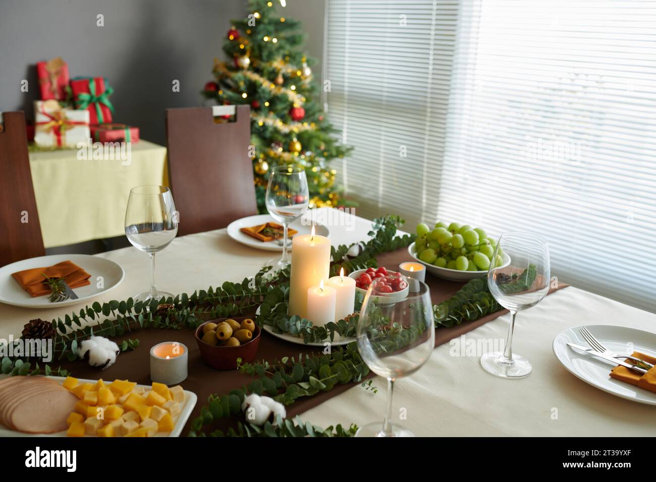 Christmas dinner table with various appetizers prepared for family ...
