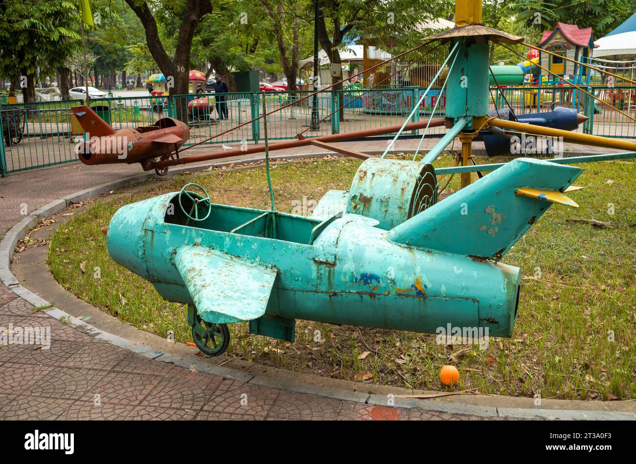 A very old and delapidated childrens carousel featuring rusted metal ...