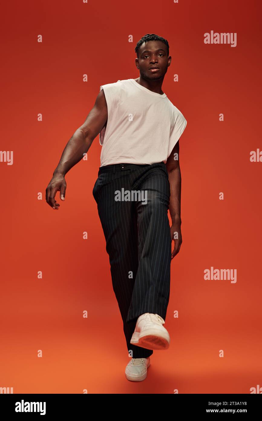 full length of charismatic and fashionable african american man posing ...