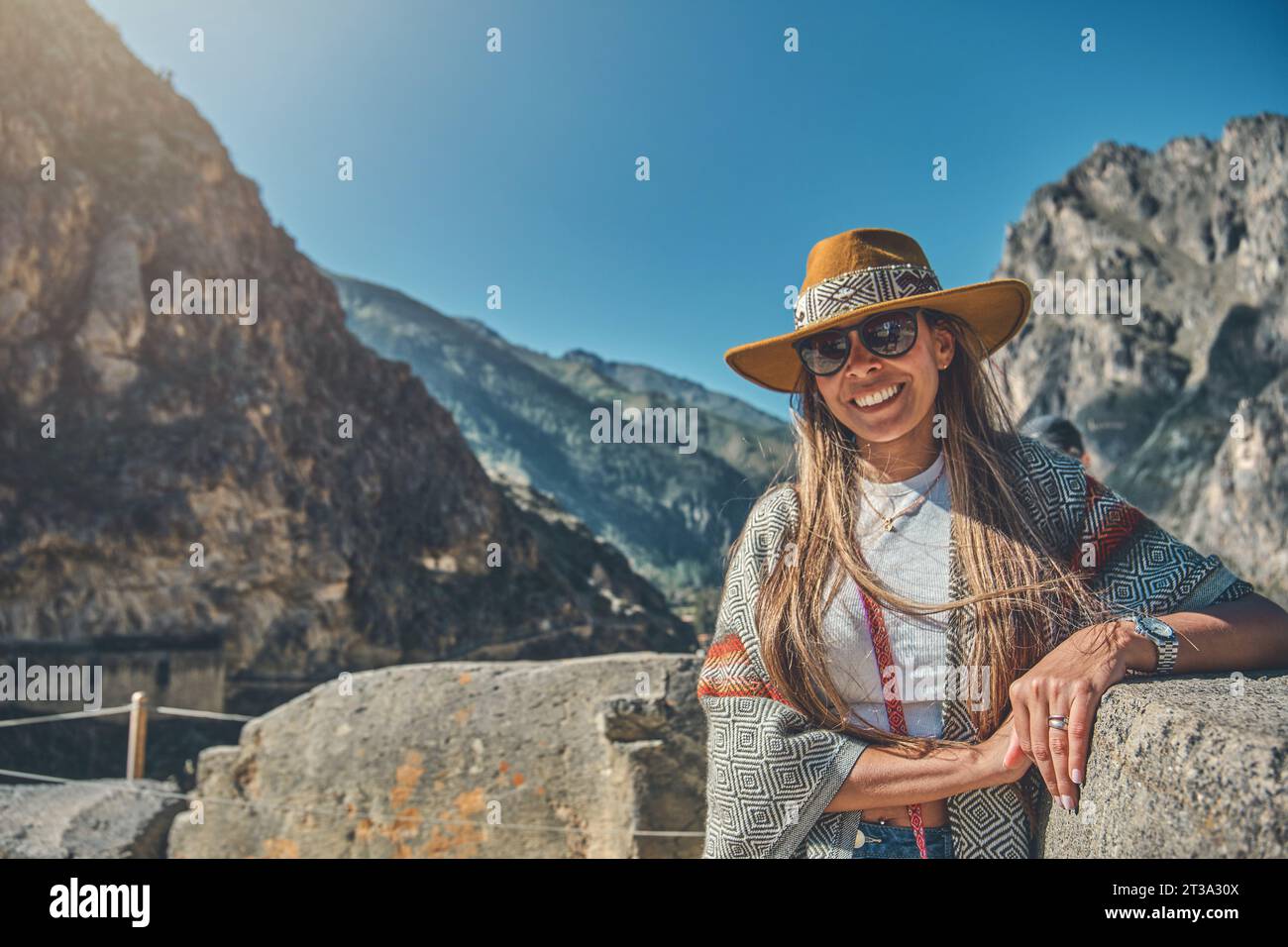 Traveler hipster girl in hat with backpack exploring ruins of ...