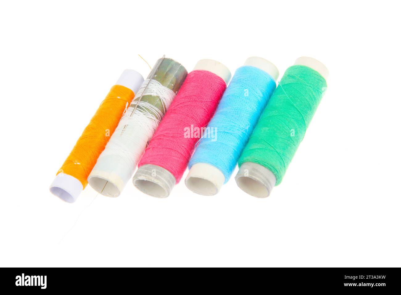 simple color thread on a white background Stock Photo - Alamy