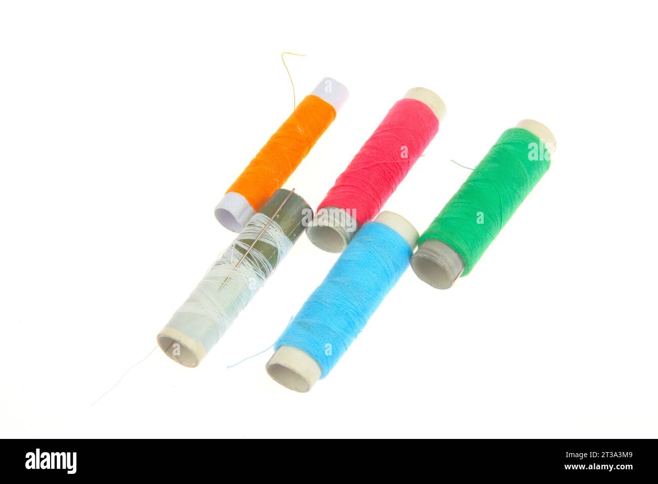 simple color thread on a white background Stock Photo - Alamy