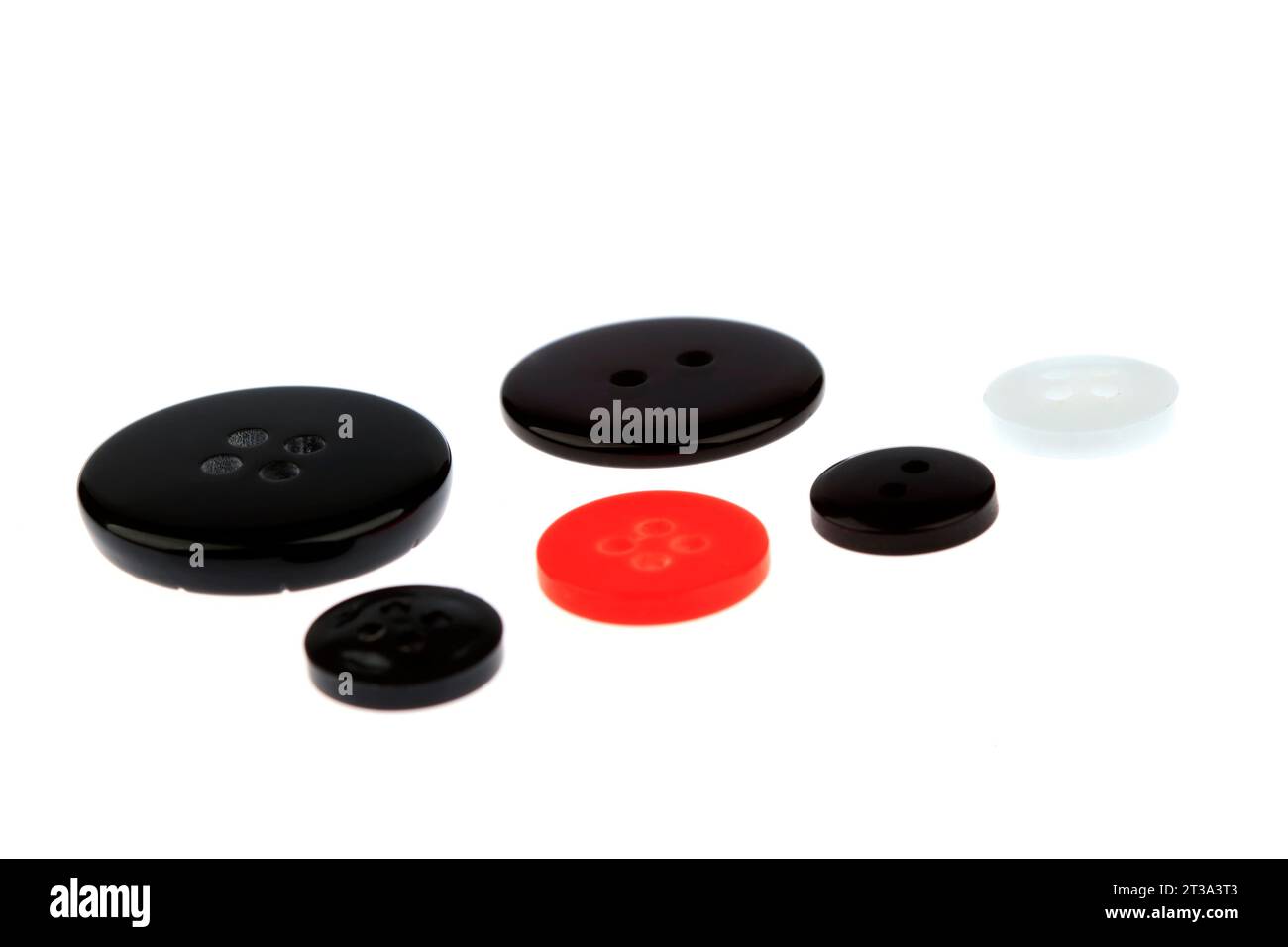 plastic material button on a white background Stock Photo - Alamy