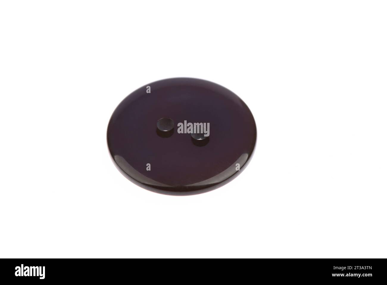 plastic material button on a white background Stock Photo - Alamy