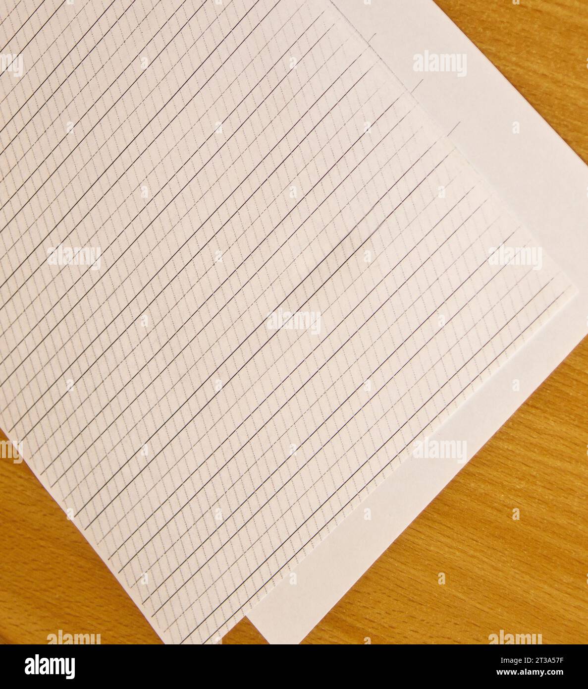 empty white paper sheet with stripes drawn. stationery on desk close up ...