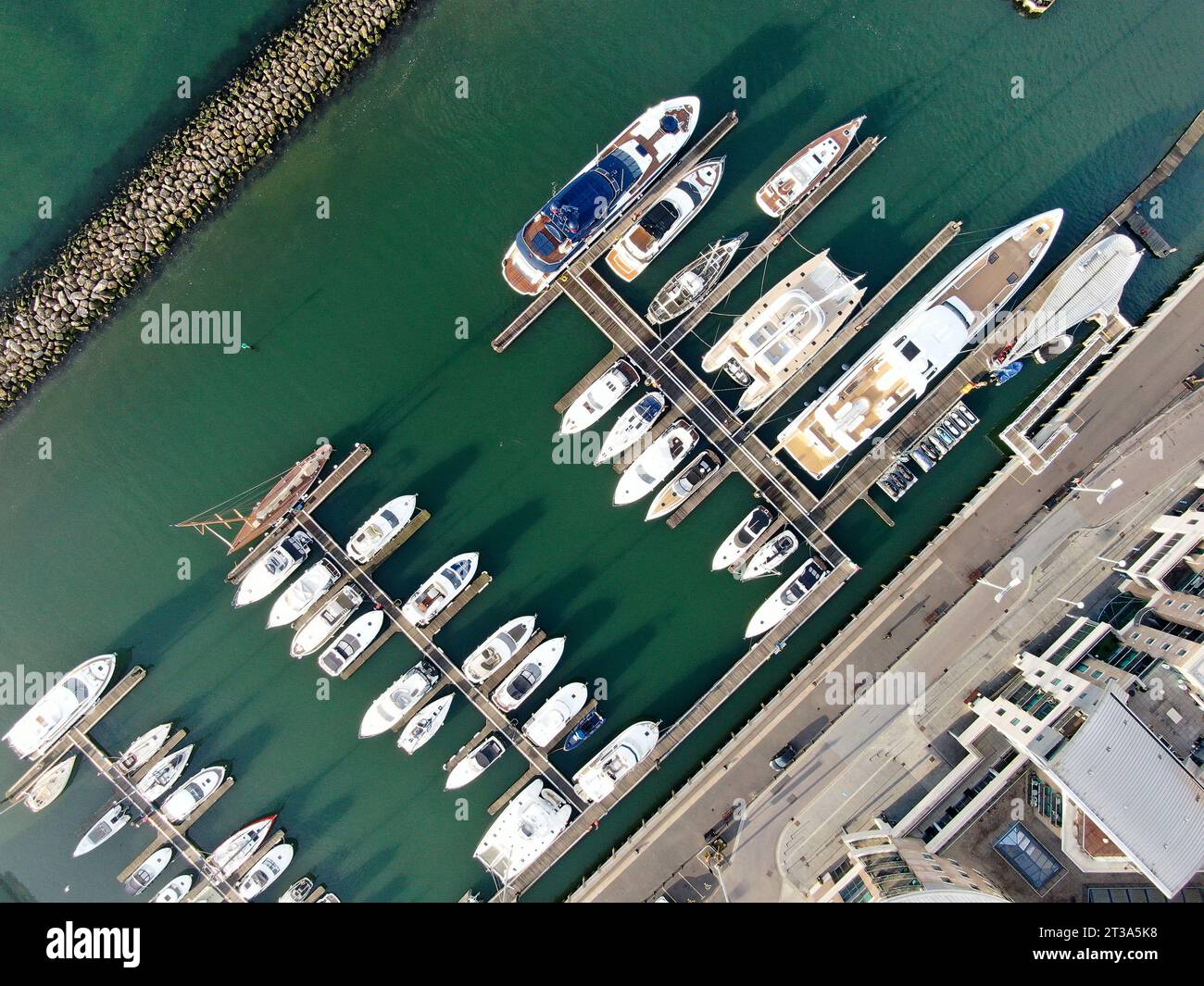 Aerial view of a marina with expensive yachts looking from directly ...