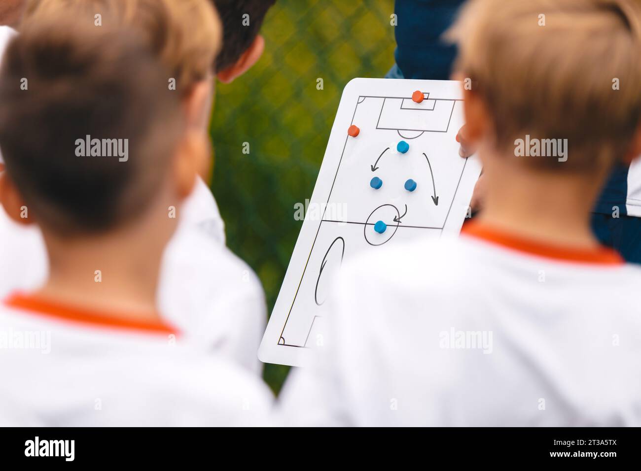 Sports Tactics Stratego Board. School Coach Explaining Game Tactics to ...