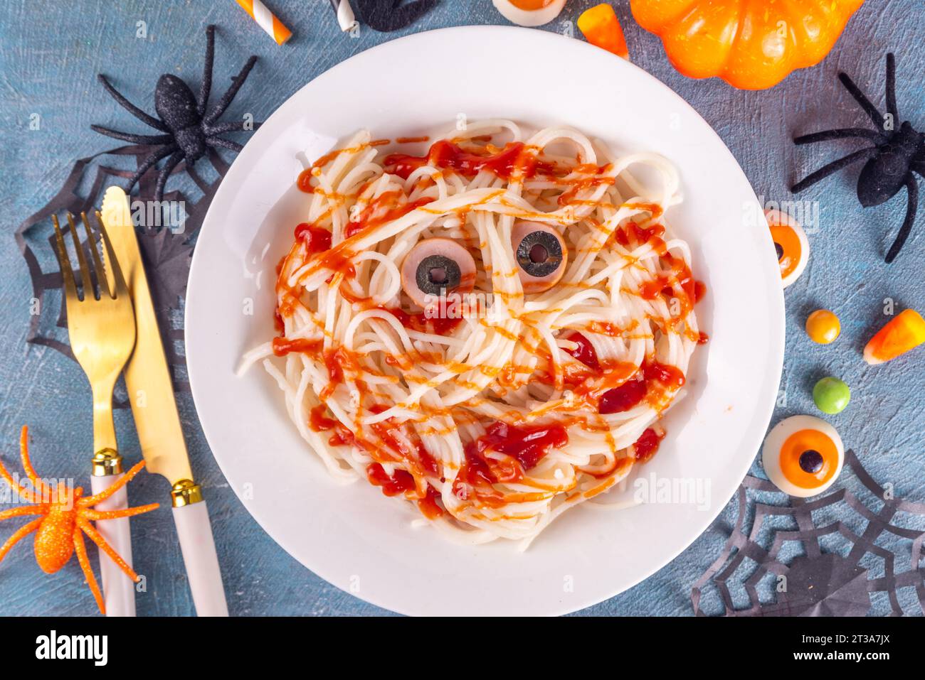 Funny kids food for Halloween lunch or dinner. Spaghetti pasta with ...