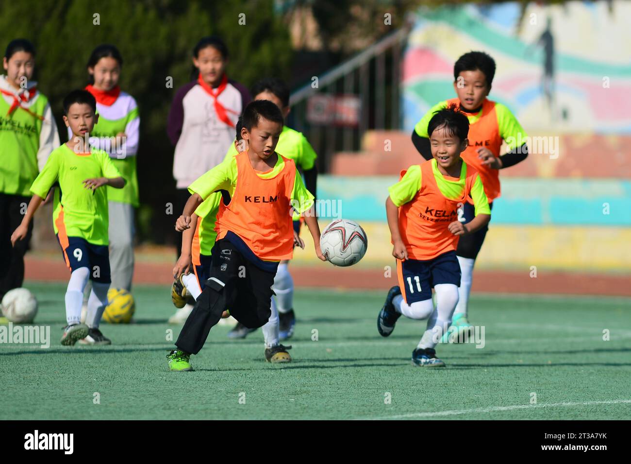 QINGDAO, CHINA - OCTOBER 24, 2023 - Primary school students train on a ...