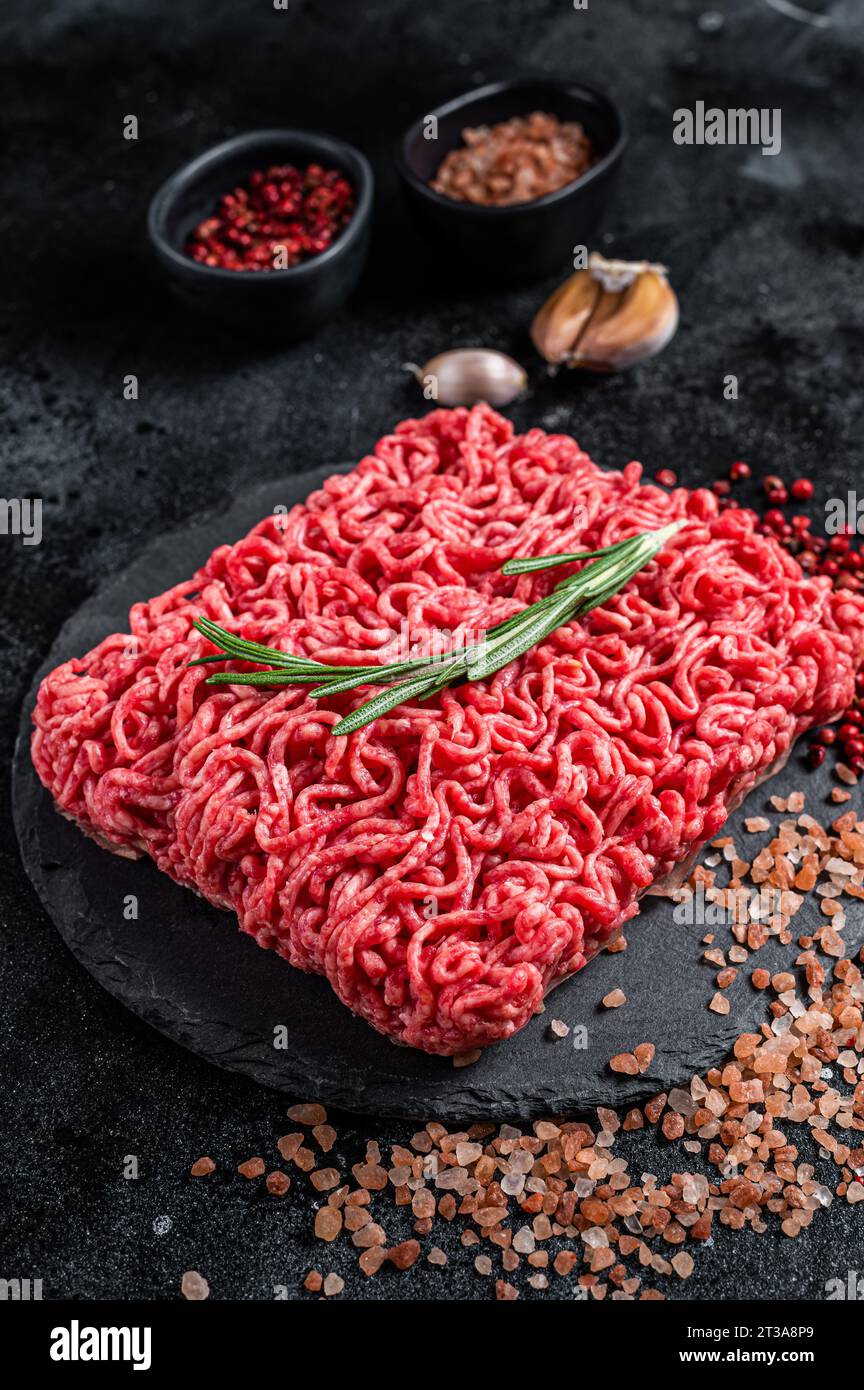 Uncooked beef veal Mince Meat, raw ground meat. Black background. Top ...
