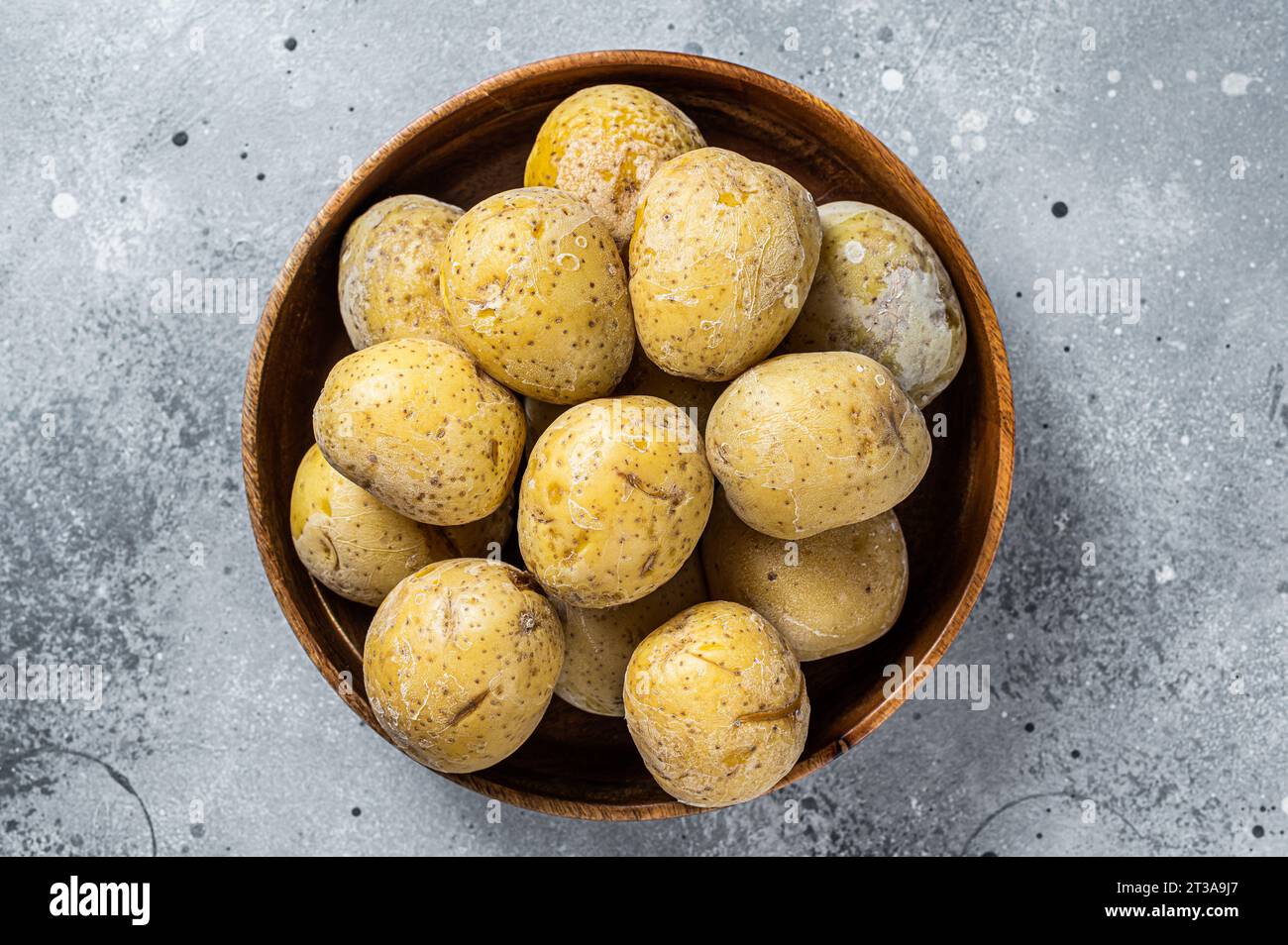 Canarian boiled potatoes papas arrugadas. Gray background. Top view ...
