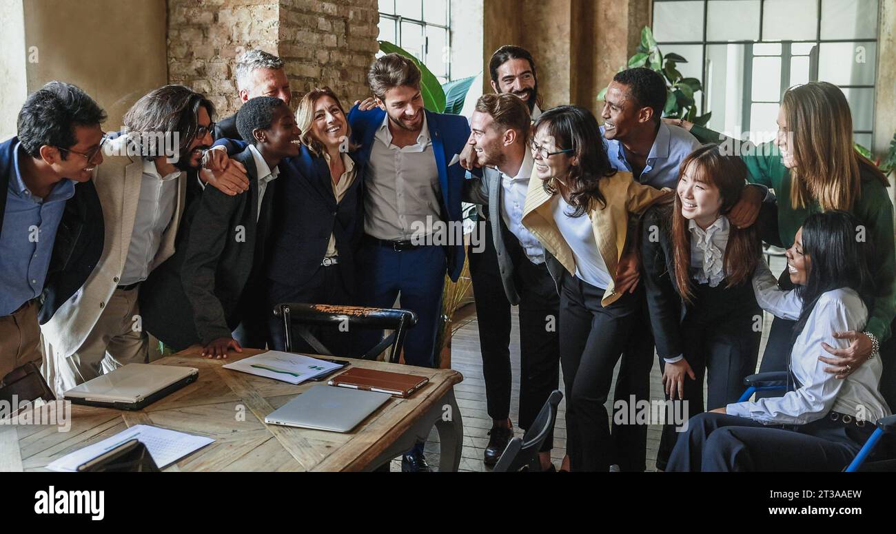 Multigenerational colleagues supporting each others inside business ...