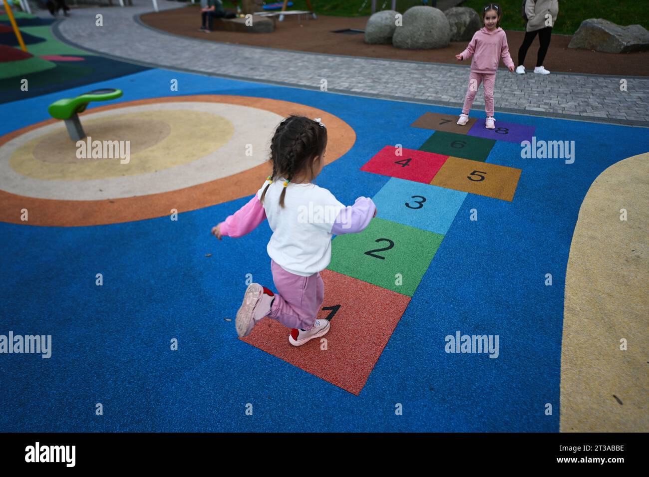 Cute little girl playing hopscotch game in the playground Stock Photo ...