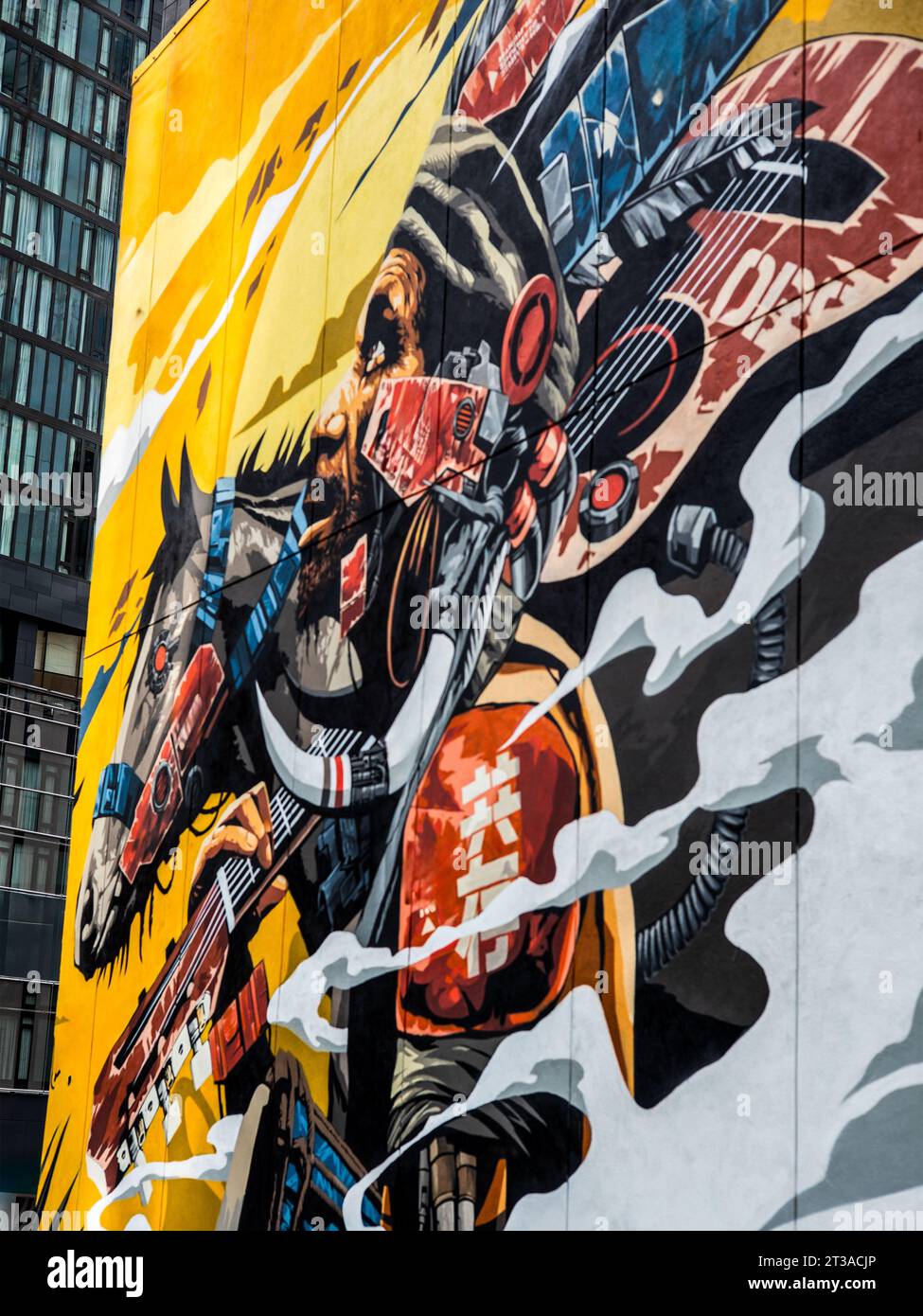 Large Graffiti on a building in New York, with another glass building ...