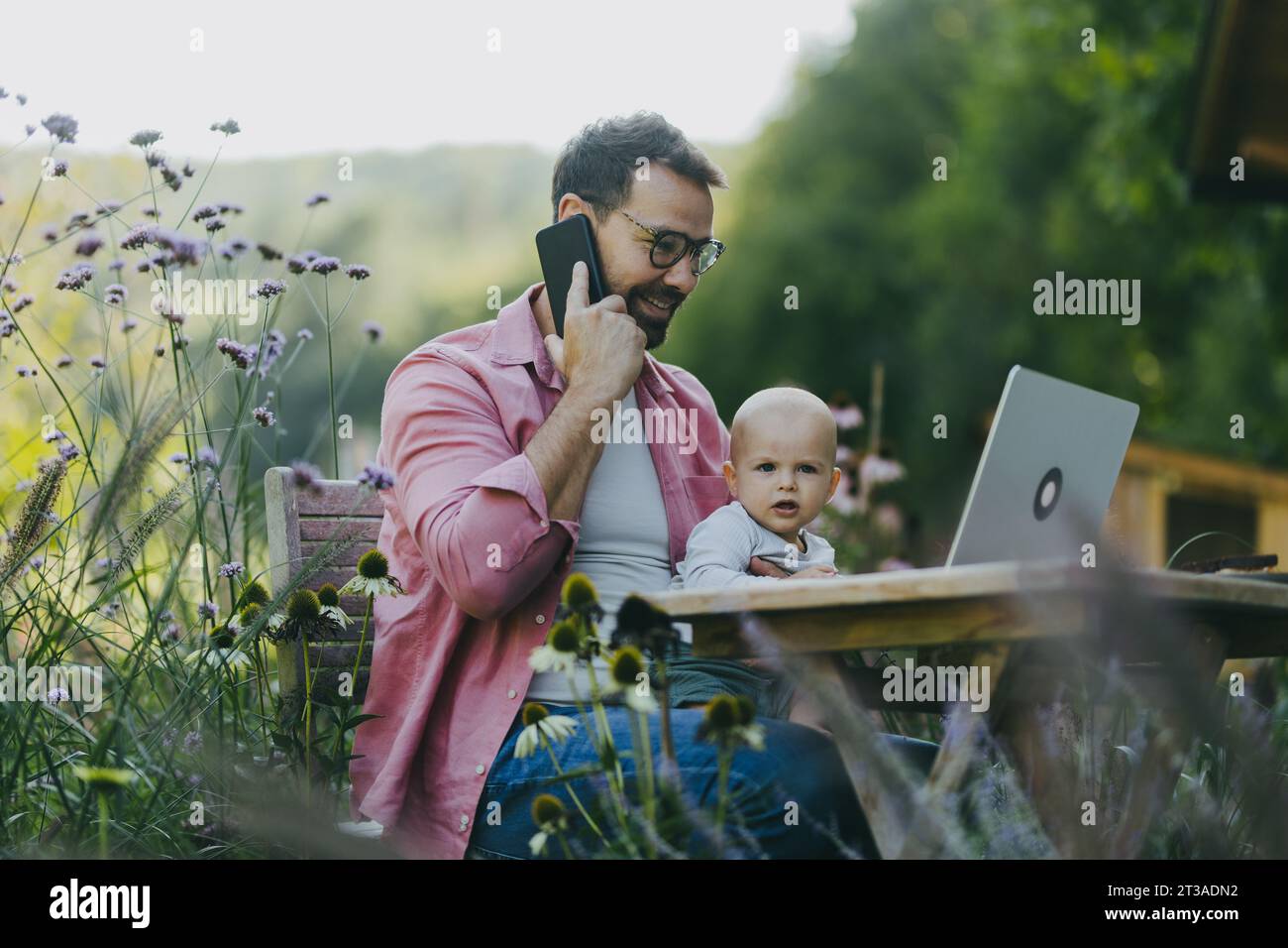 Multitasking father working remotely from hi-res stock photography and ...