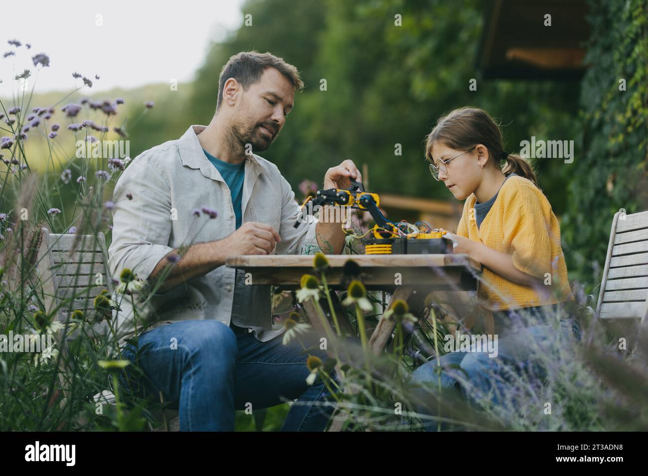 Father supporting daughter in pursuing robotics, science, IT ...