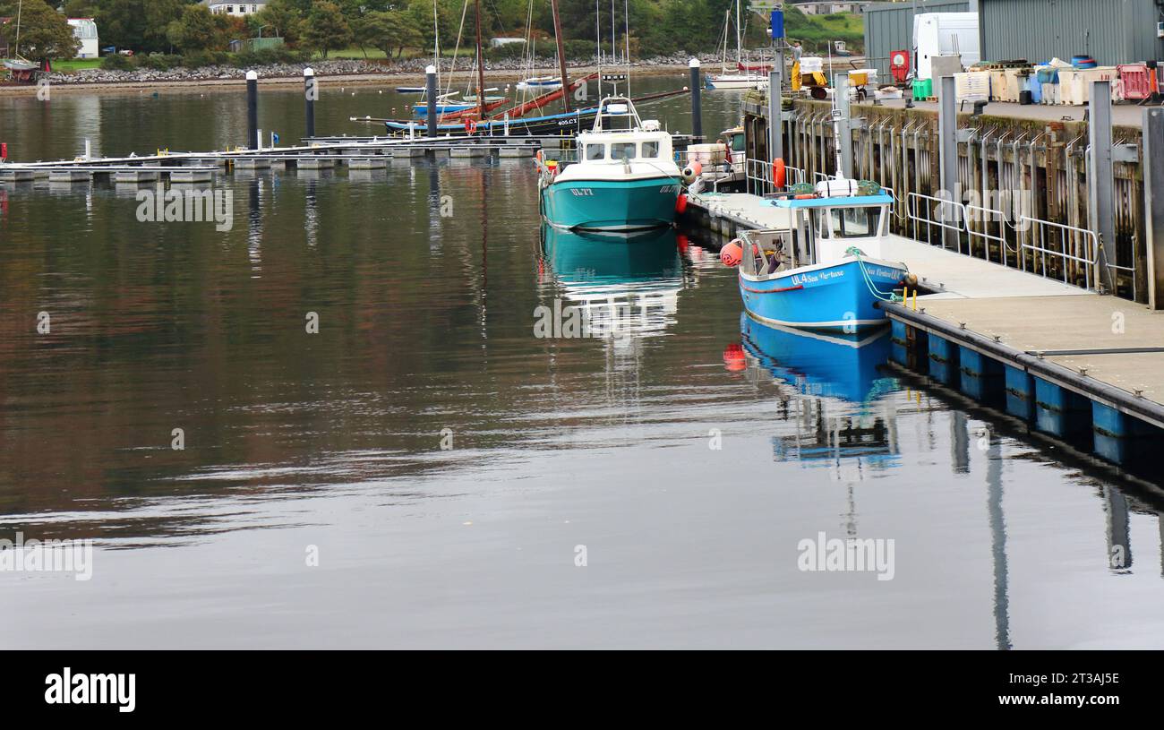 A view of fishing boats in harbour on the west coast of Scotland in the ...