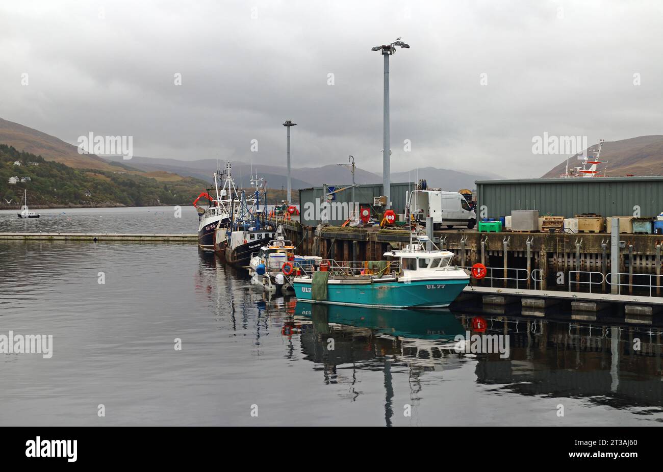 A view of fishing boats in harbour on the west coast of Scotland in the ...